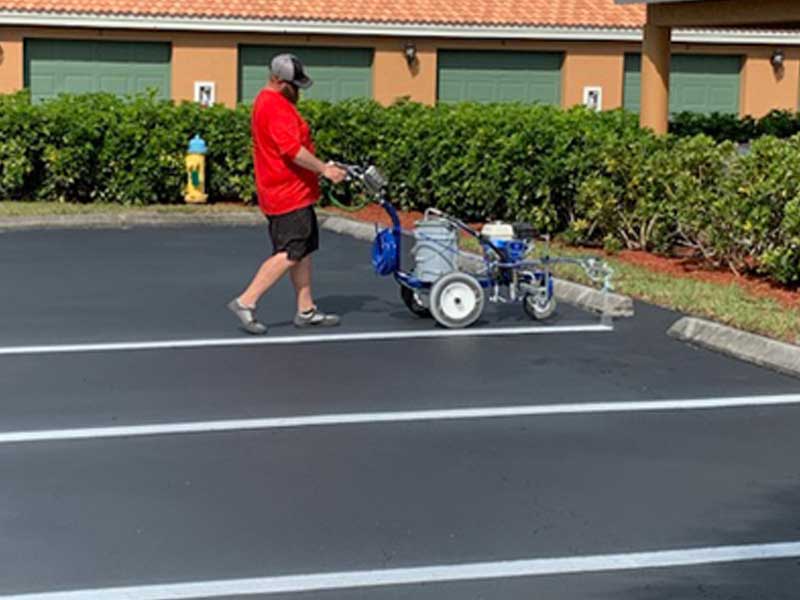 Parking lot and roadway line striping and pavement markings